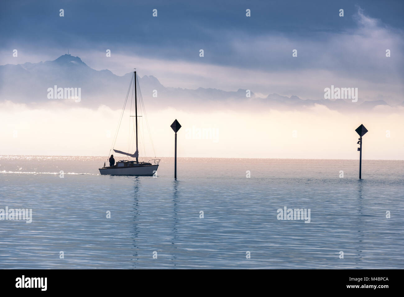Boat sailing on a lake Stock Photo - Alamy