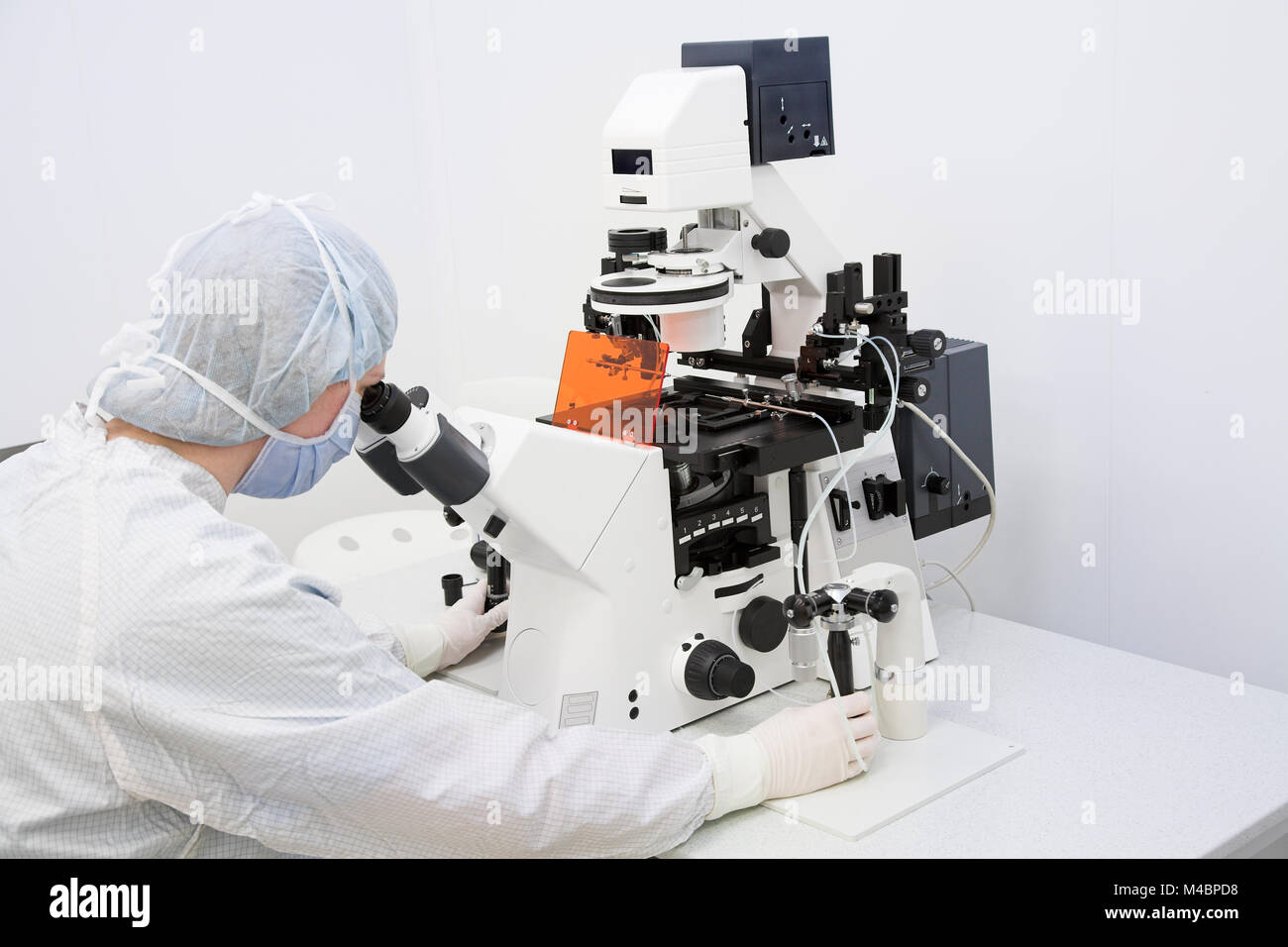Woman looking microscope laboratory hi-res stock photography and images ...
