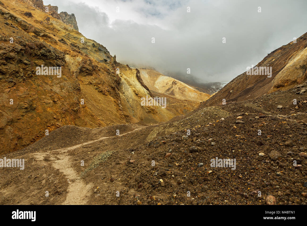 Beautiful scenery slopes of volcano Mutnovsky with clouds Stock Photo ...