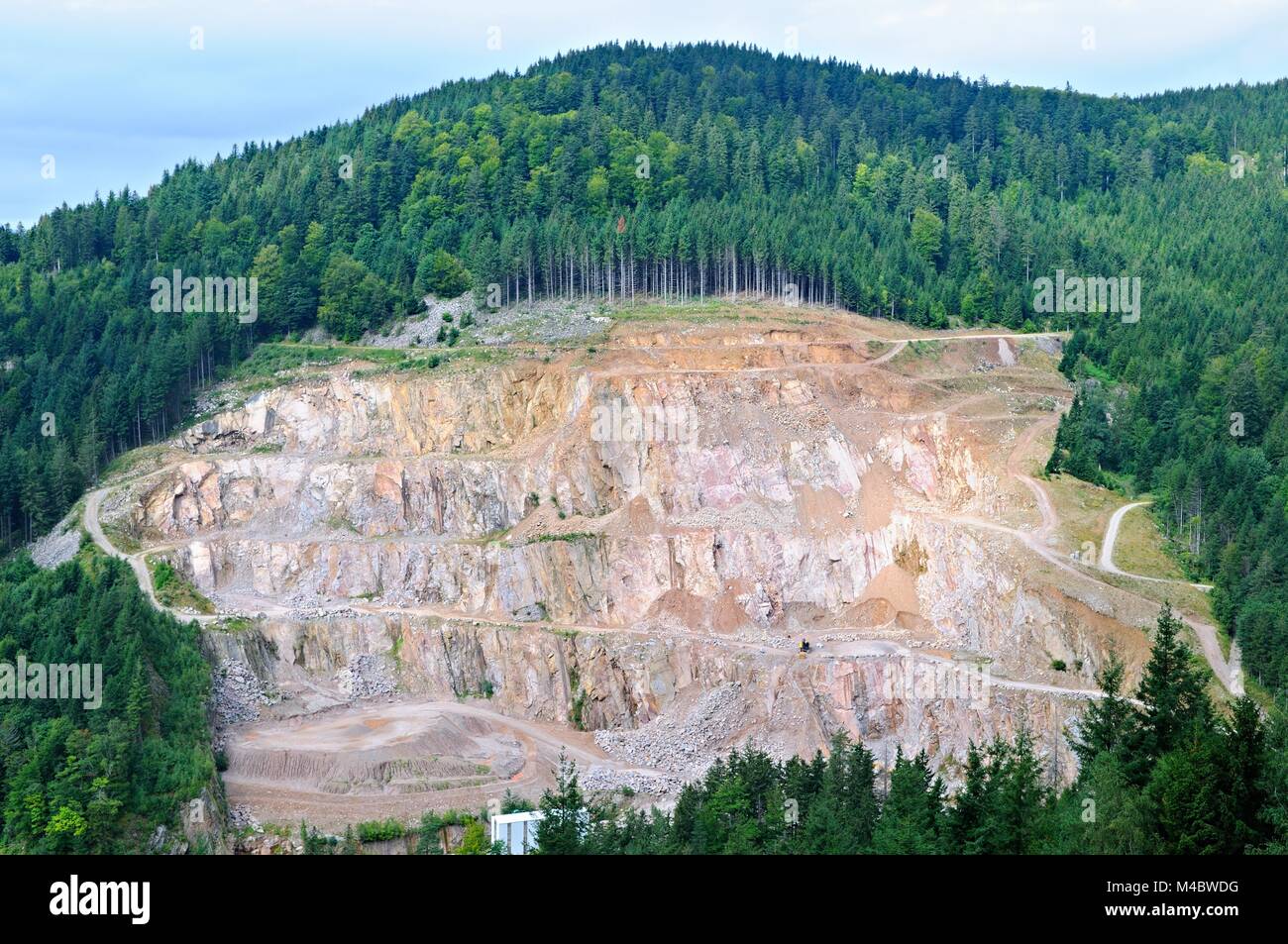 Demolition of granite rock in opencast mining Black Forest Germany ...