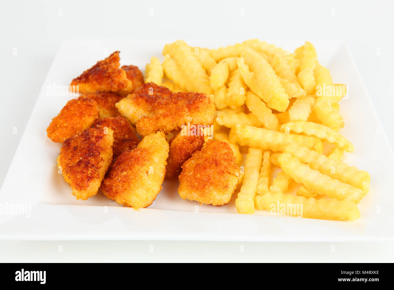 french fries with chicken nuggets Stock Photo - Alamy