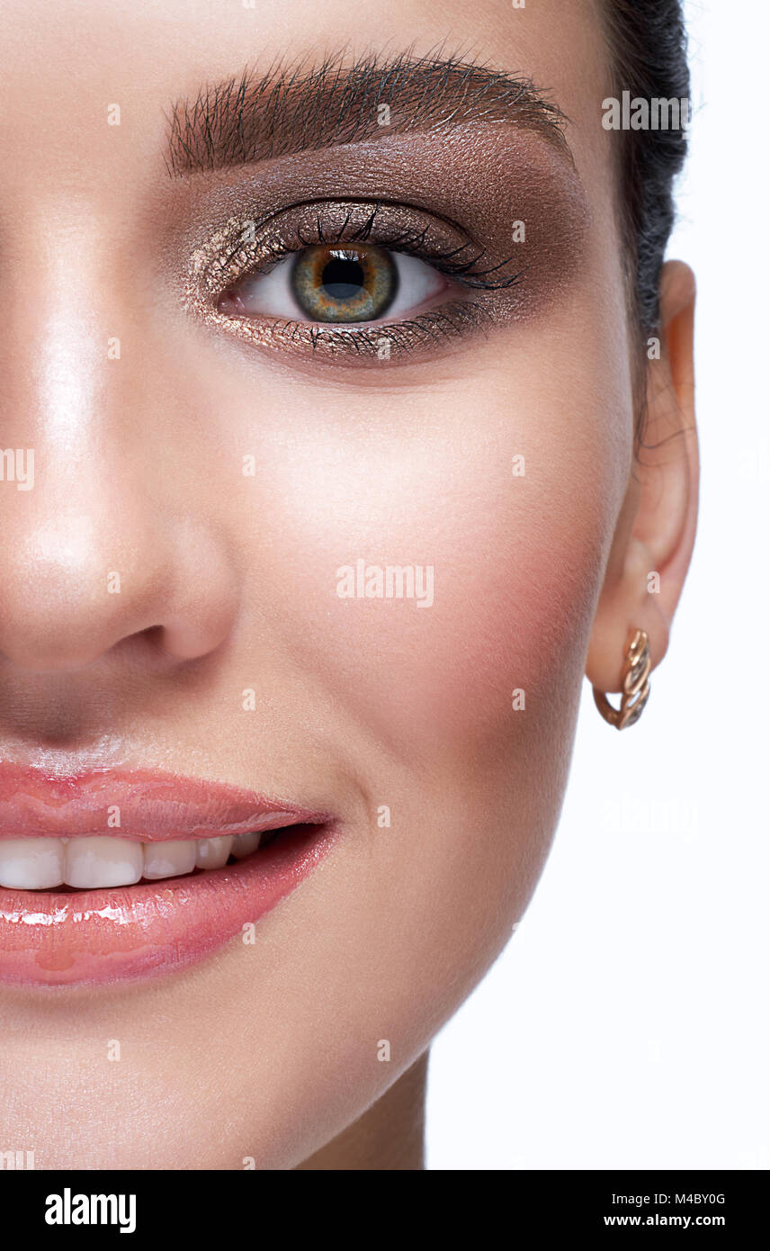 Half face female smiling portrait with day makeup Stock Photo - Alamy