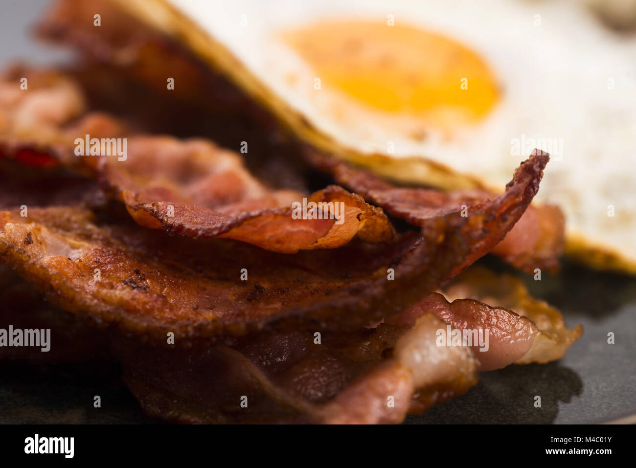 Fried Egg And Bacon Rashers Stock Photo - Alamy