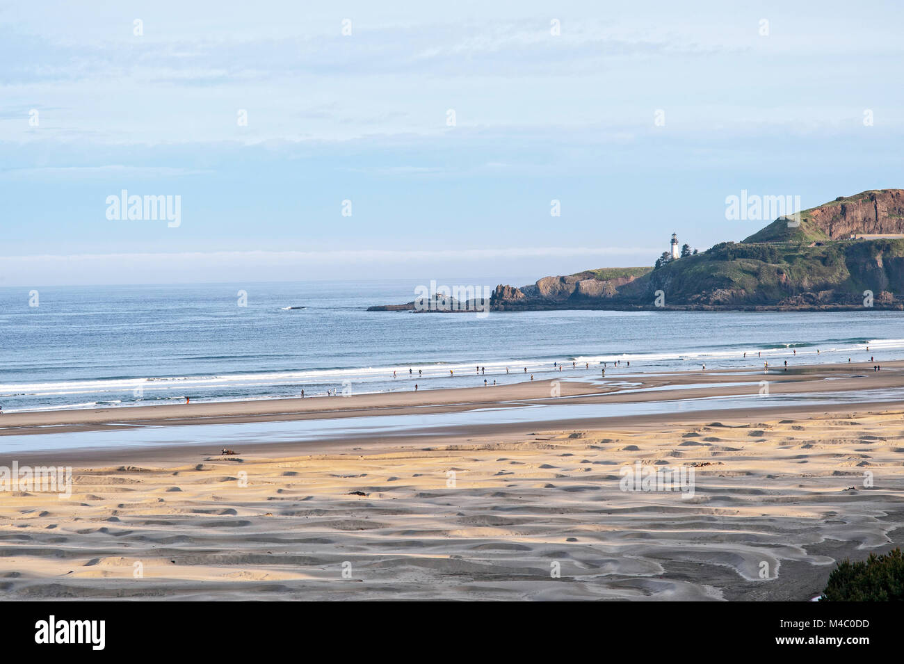 A lighthouse on the a rocky point in Oregon Stock Photo - Alamy