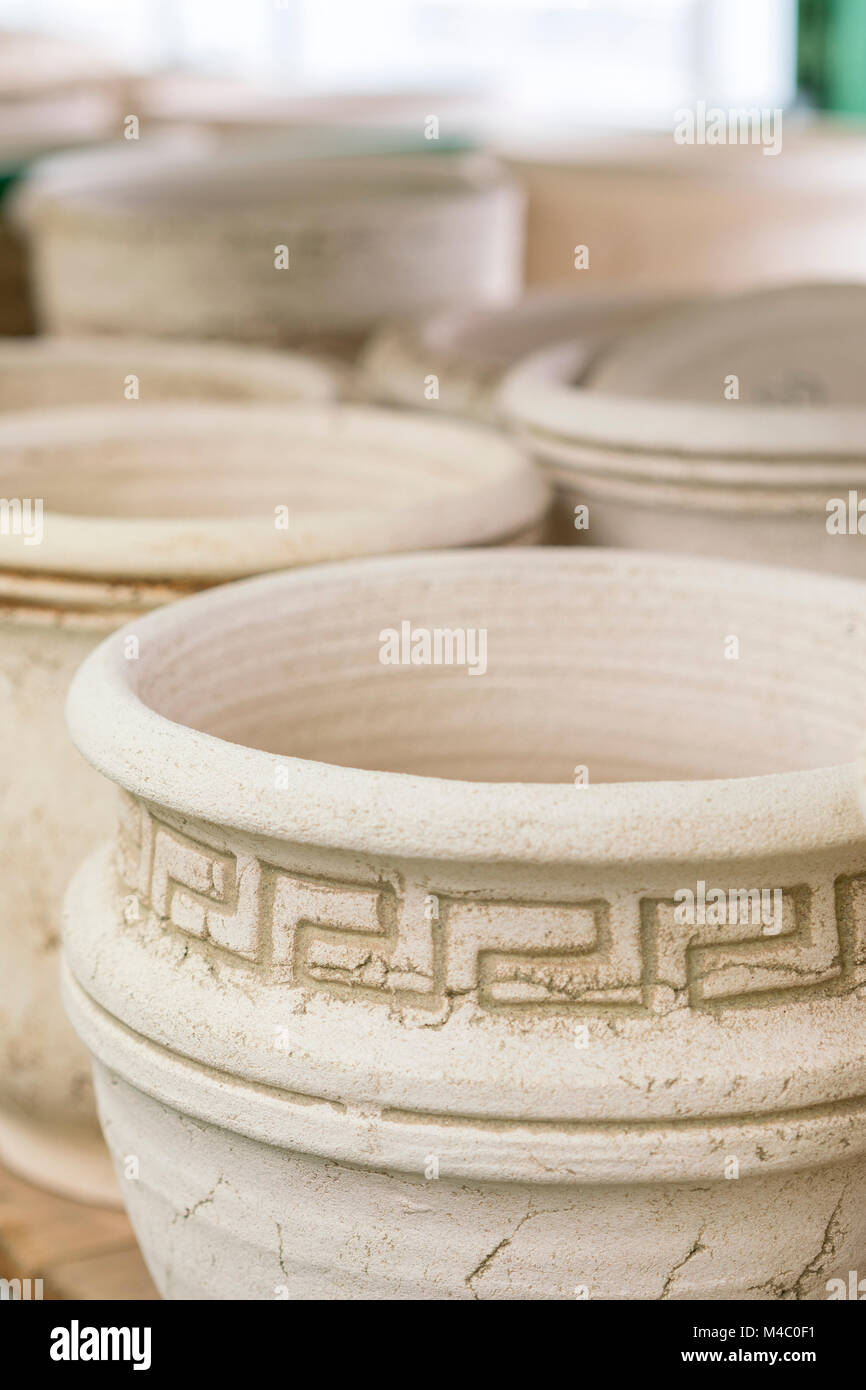 Large empty clay pots on the shelf Stock Photo - Alamy