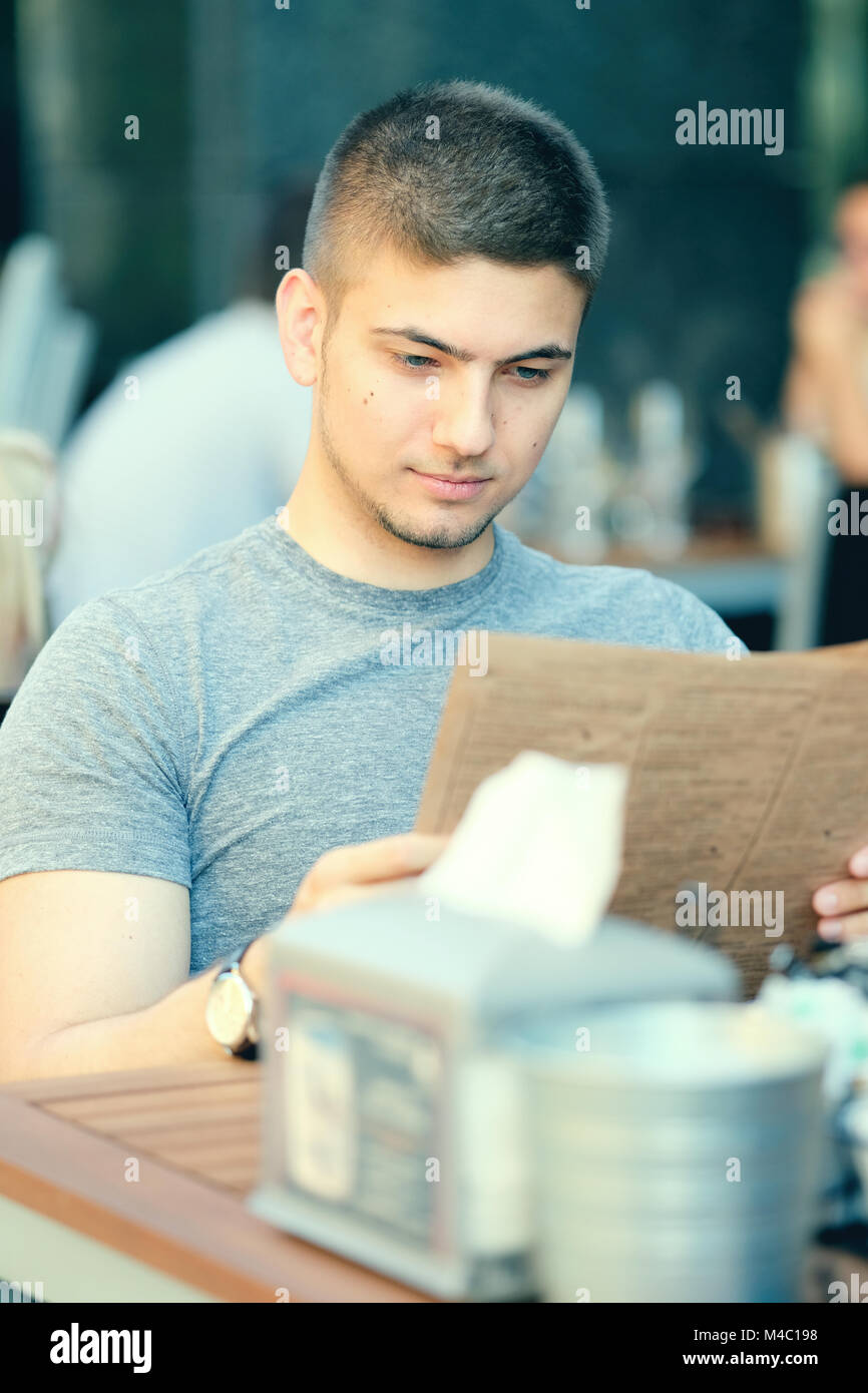 Guy looking at menu hi-res stock photography and images - Alamy
