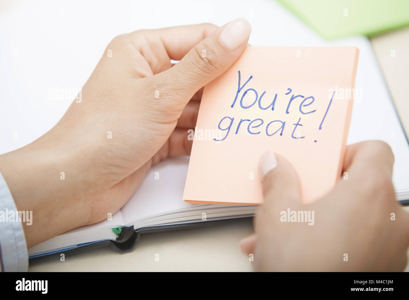 Positive text on adhesive note Stock Photo - Alamy