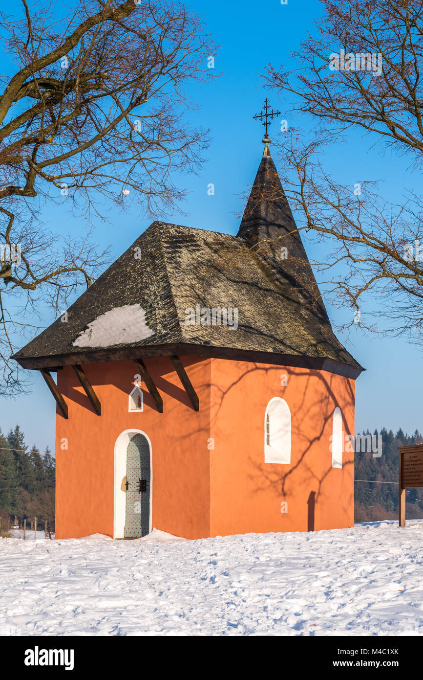 Red chapel in winterlandscape Stock Photo - Alamy