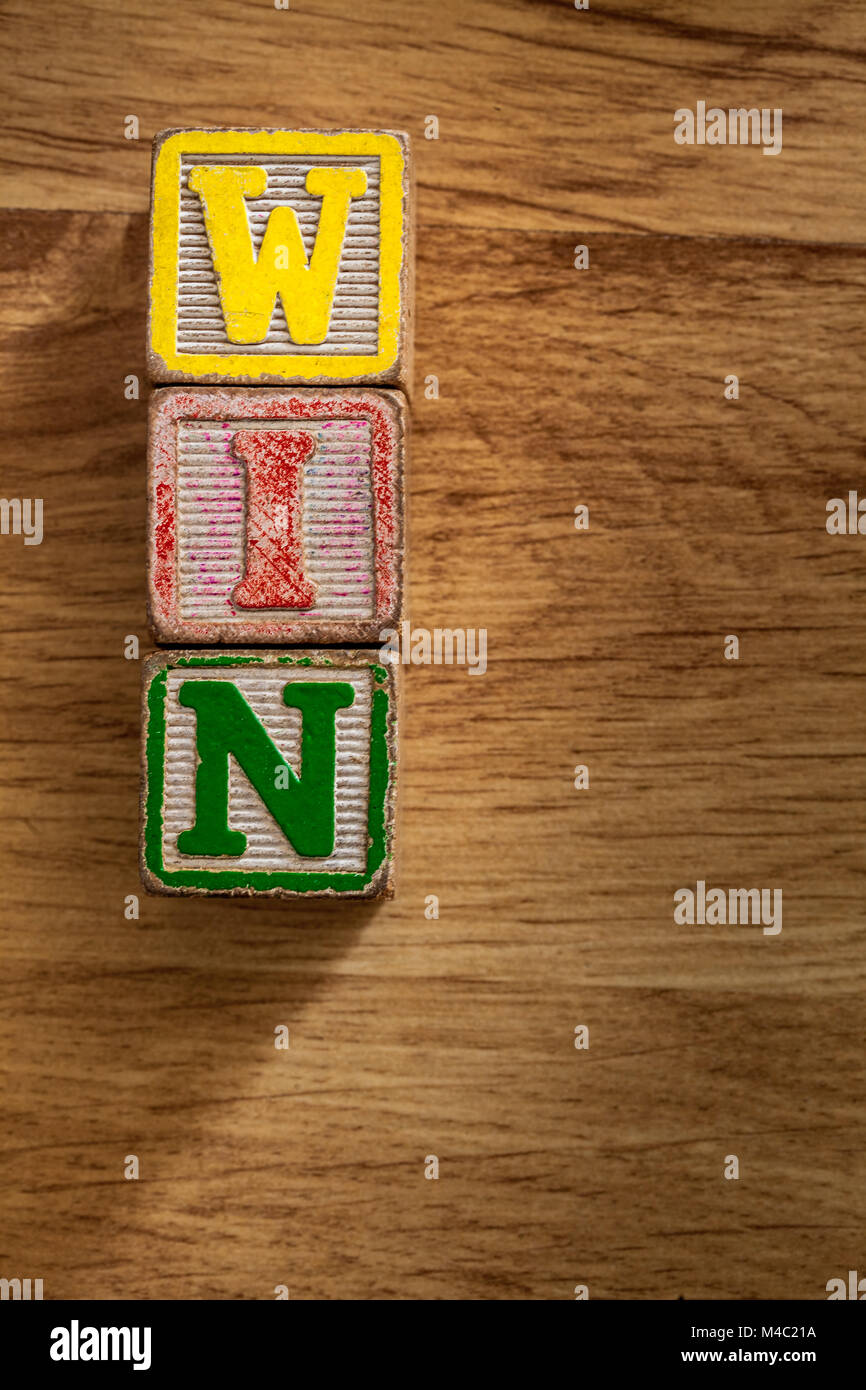 Wooden Toy Blocks Spell Win Stock Photo - Alamy