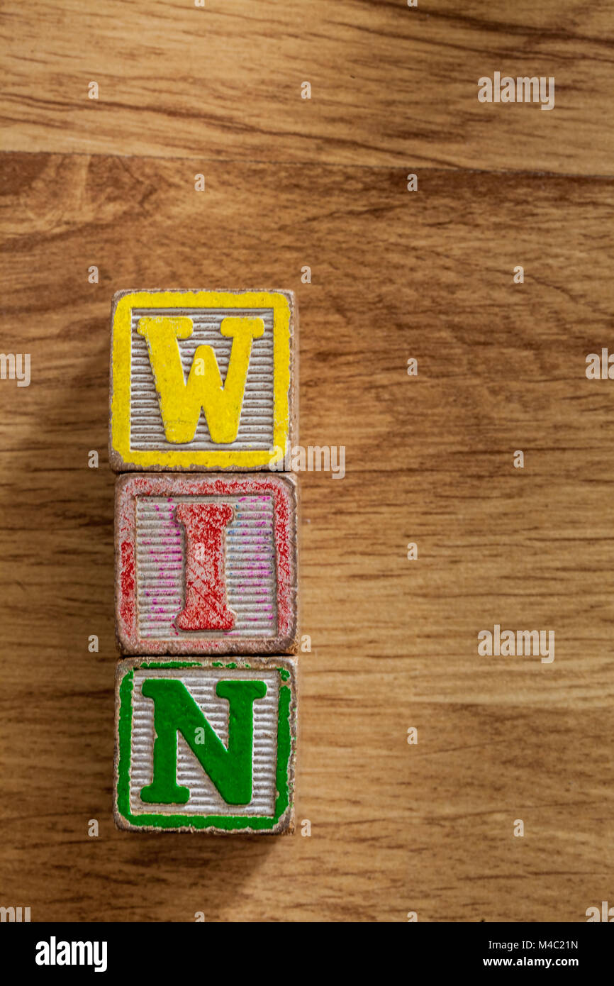 Wooden Toy Blocks Spell Win Stock Photo - Alamy