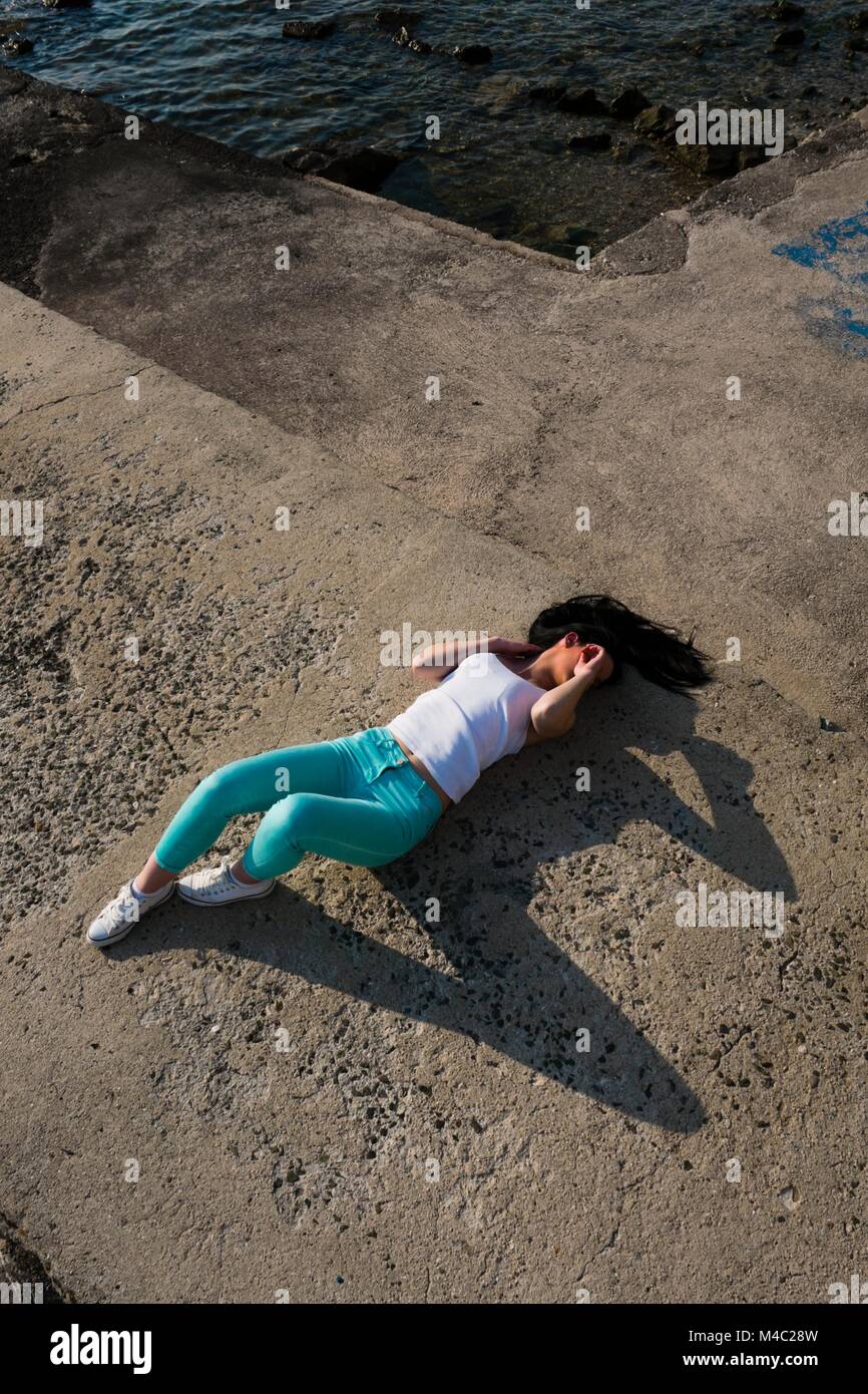 Laying lying down position posture hi-res stock photography and images ...