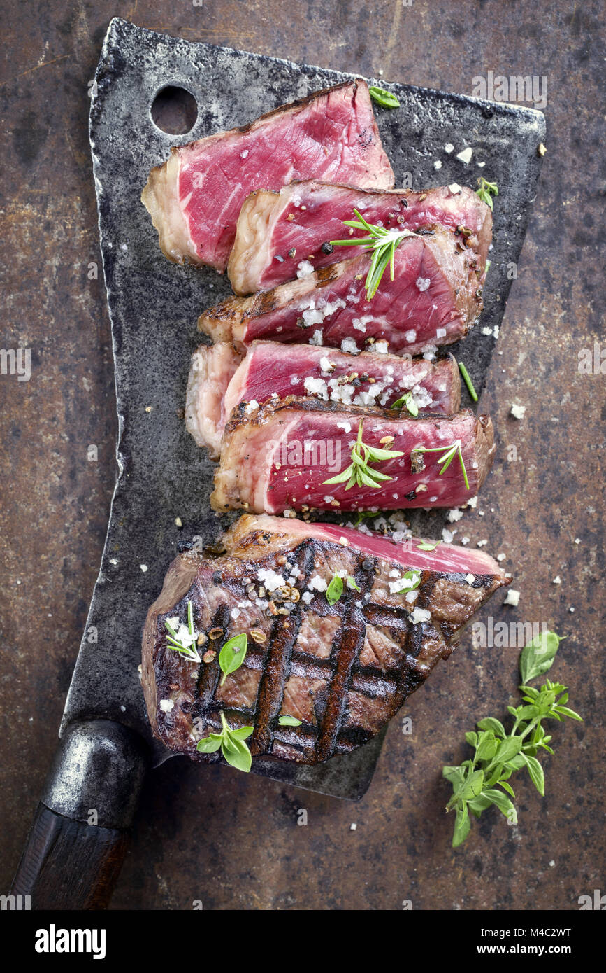 Barbecue Aged Roast Beef on old Metal Sheet Stock Photo - Alamy