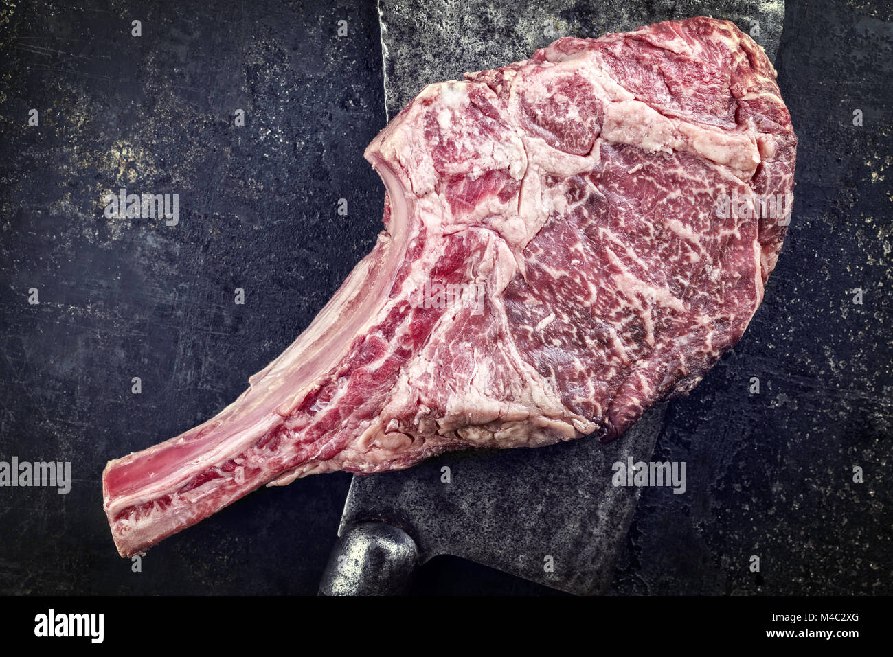 Wagyu Tomahawk Steak on old Kitchen Cleaver Stock Photo - Alamy