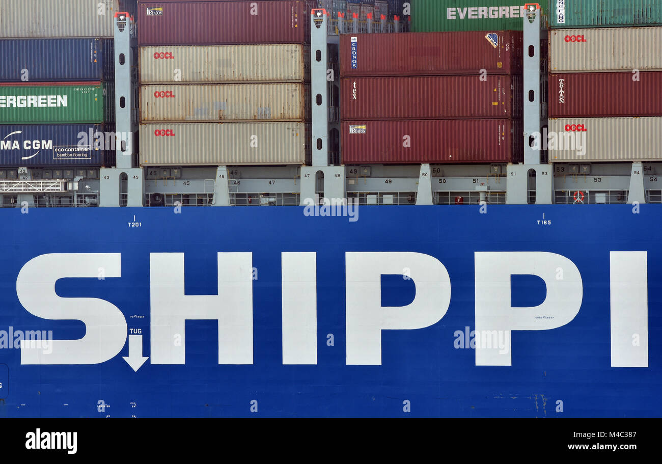 containers stacked on a very large enormous container vessel or ship ...