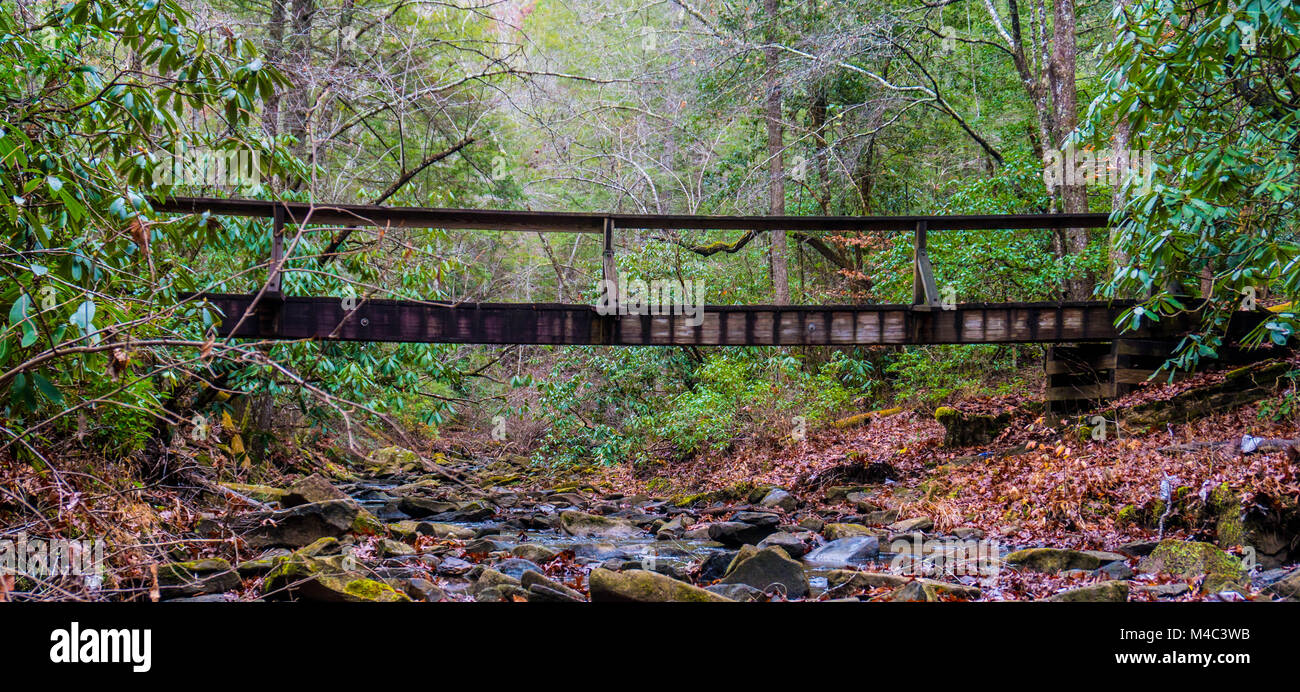 Here's a wonderful picture of an old wooden bridge crossing over a ...