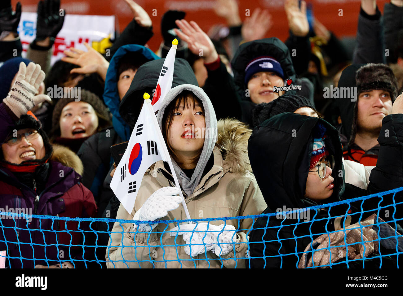 Pyeongchang, South Korea. 15th Feb, 2018. Korean fan watches athletes ...