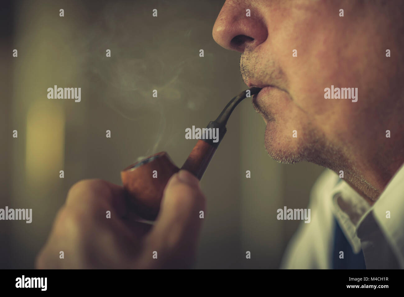 Senior pipe smoker Stock Photo - Alamy