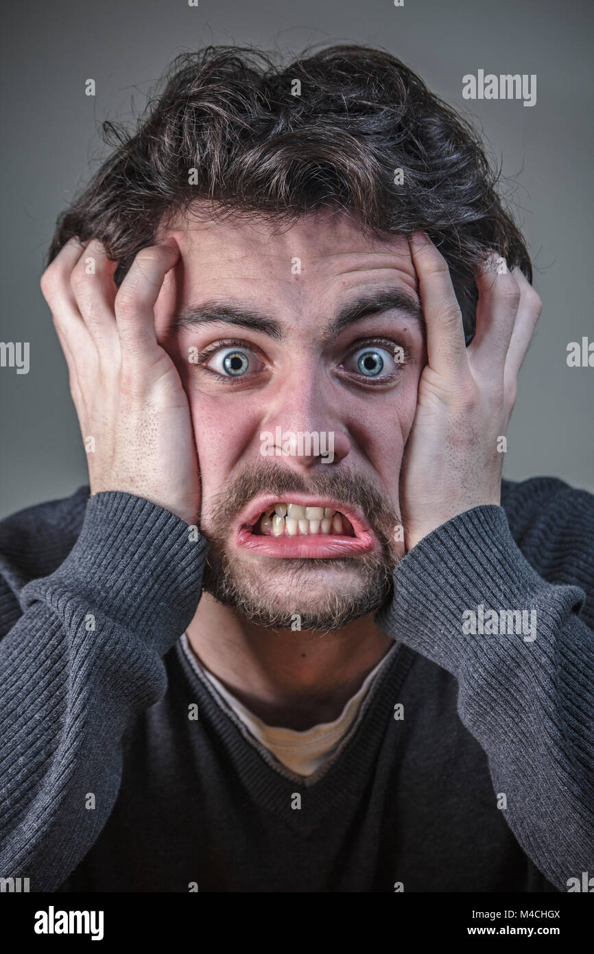 Deranged angry young man Stock Photo - Alamy