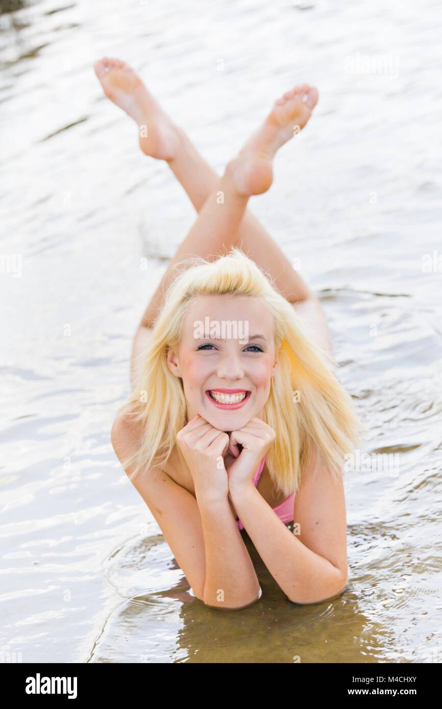 Adolescent teen laying lying down position posture Stock Photo - Alamy