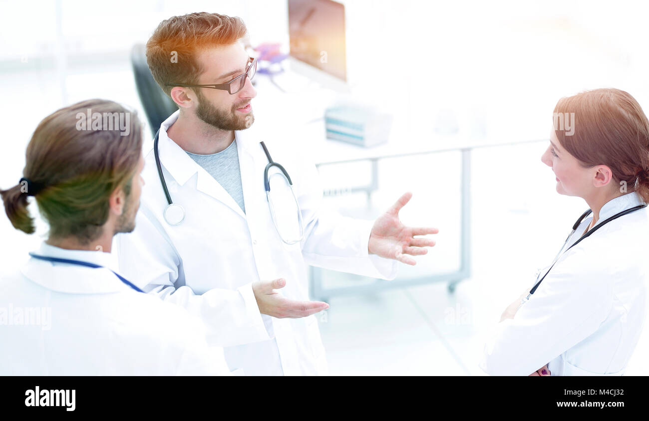 Group of doctors talking Stock Photo - Alamy