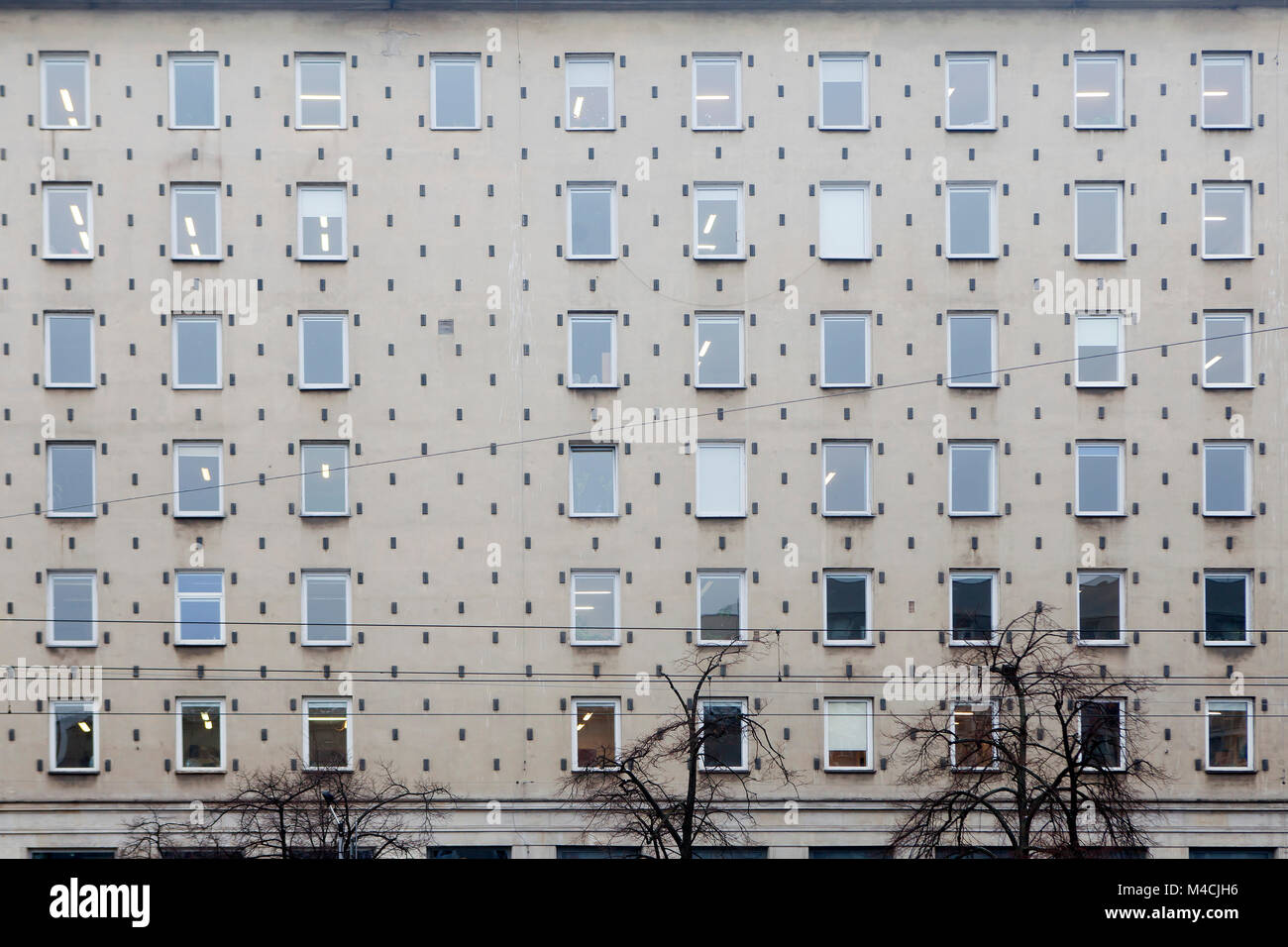 he facade of a gray office building in Warsaw in the Soviet period ...