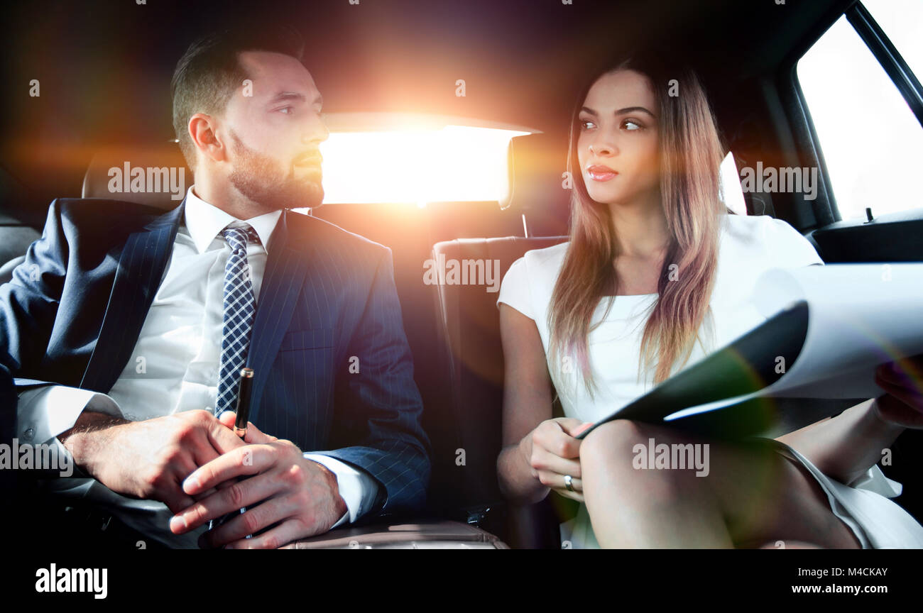 Young business team working together in the car Stock Photo - Alamy