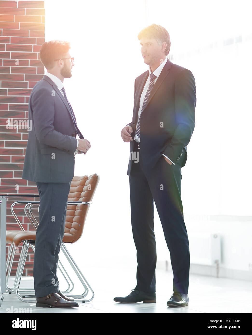Two business executives talking hi-res stock photography and images - Alamy