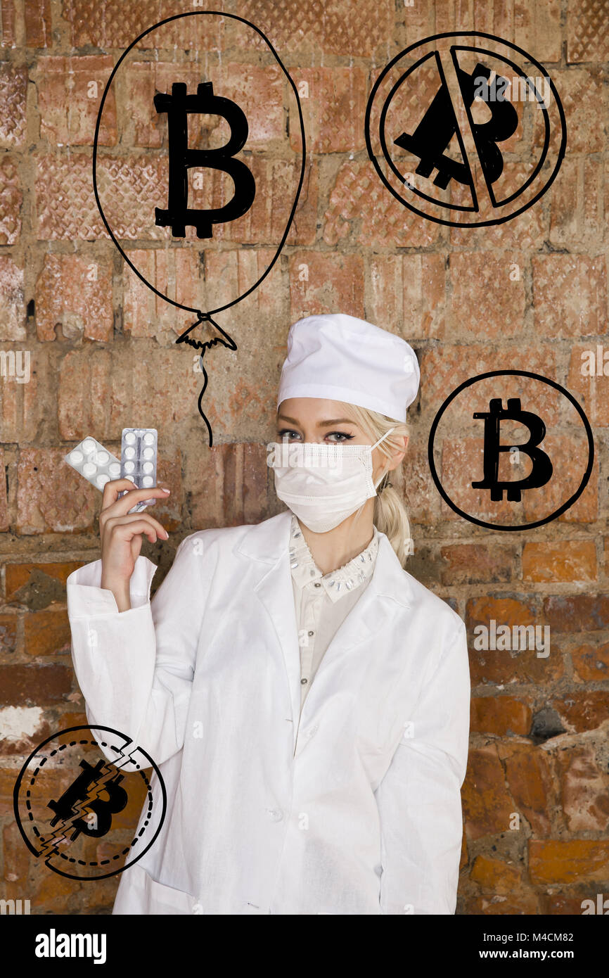 Beauty blonde young doctor standing on loft red brick background with ...