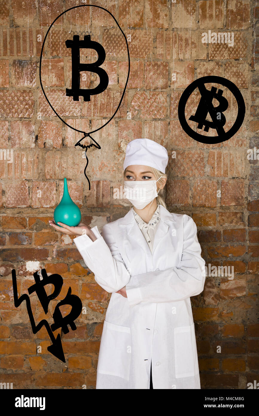 Beauty blonde young doctor standing on loft red brick background with ...