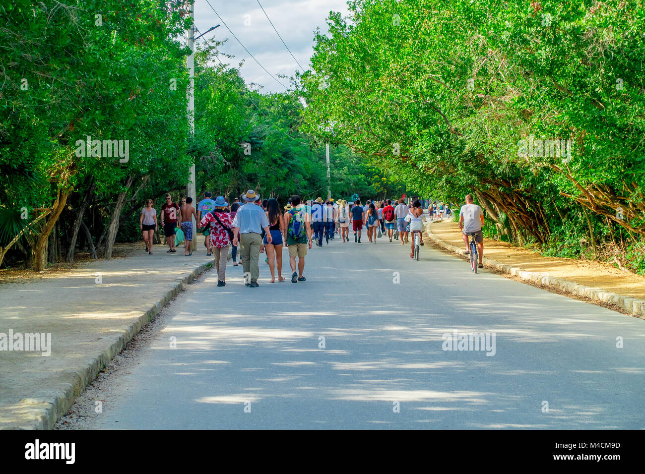 TULUM, MEXICO - JANUARY 10, 2018: Crowd of people walking in an ...