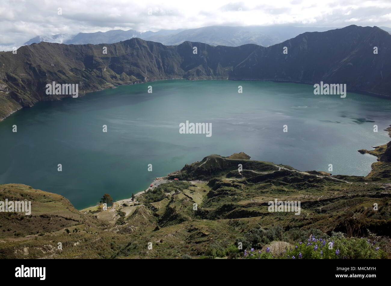 A view of Quilotoa Lake, an ancient volcano and starting point for the ...