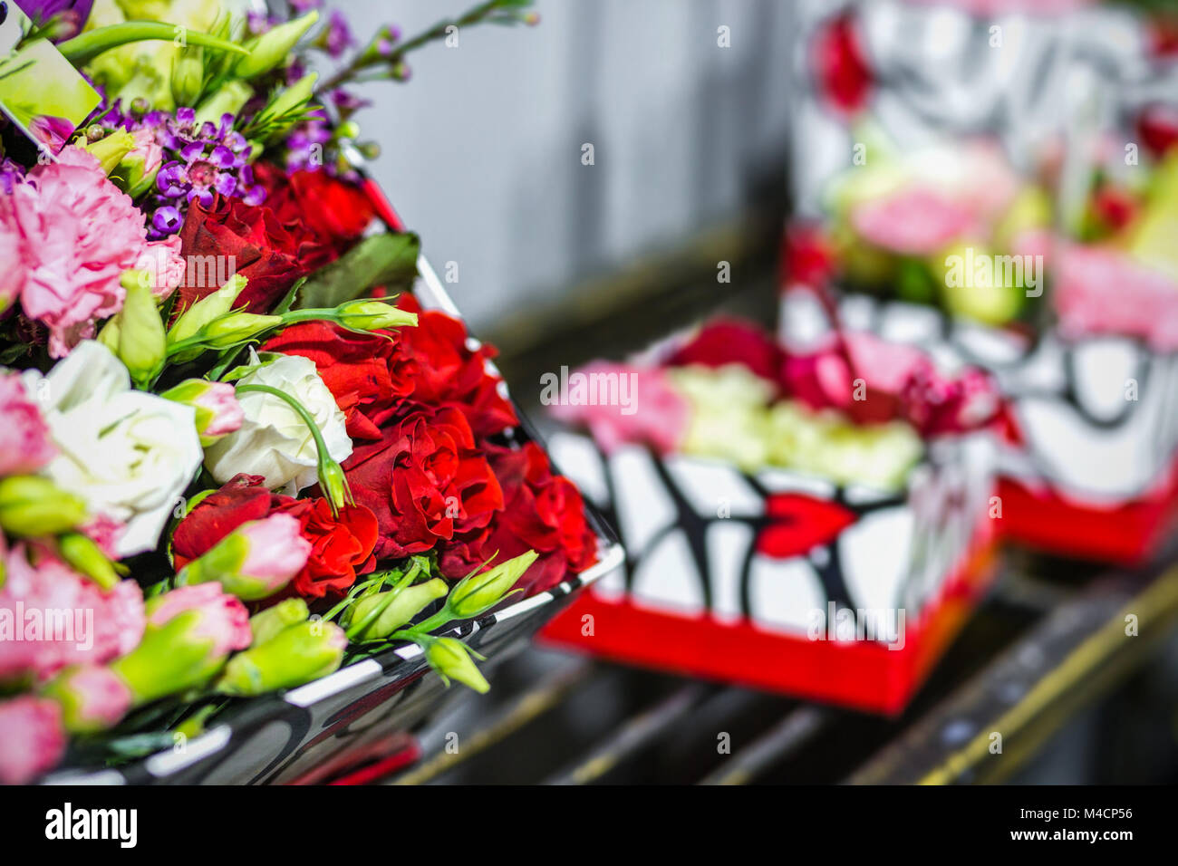Beautiful bouquet of fresh flowers in boxes. Florist service concept ...