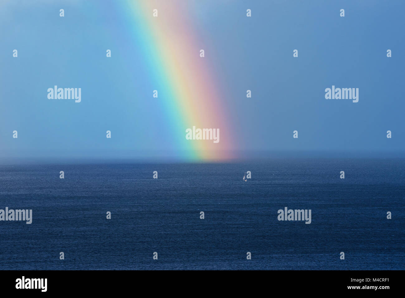 Beautiful rainbow on the ocean horizon Stock Photo - Alamy