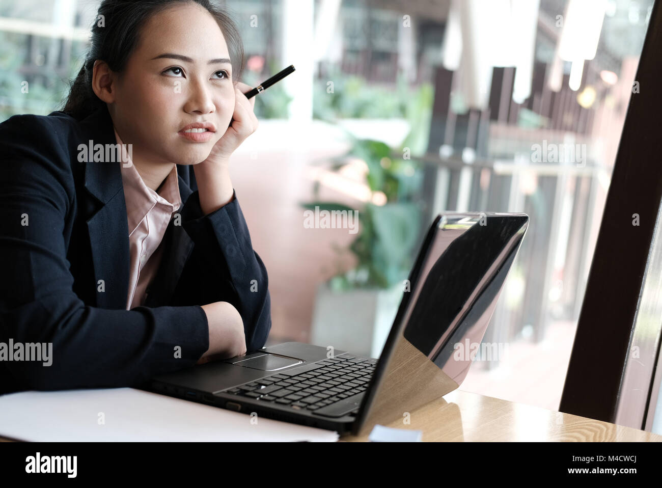 bored businesswoman lean head on hand at office. unhappy woman at ...