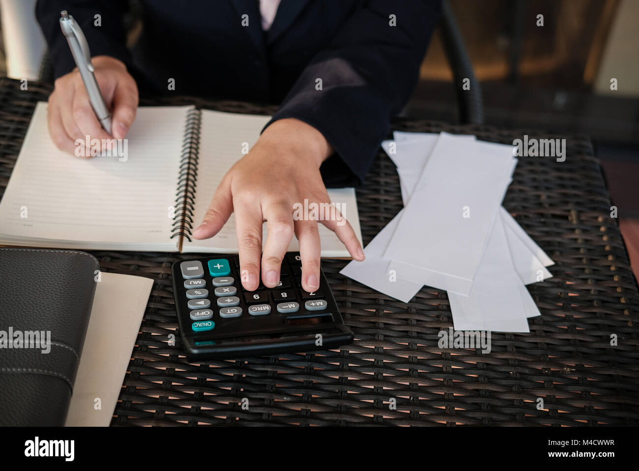 woman calculate domestic bills at home. Businesswoman using calculator ...