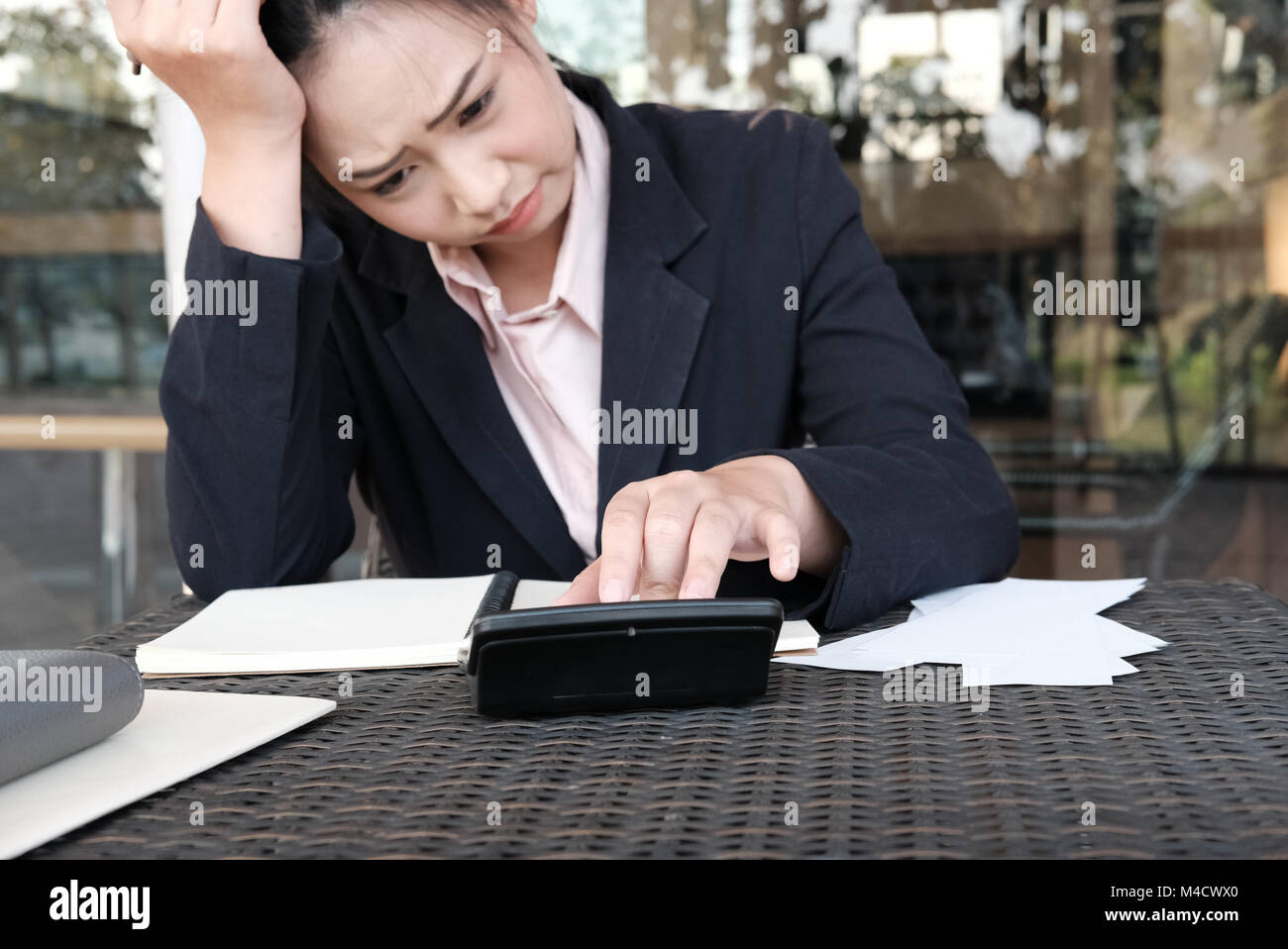 woman calculate domestic bills at home. Businesswoman using calculator ...