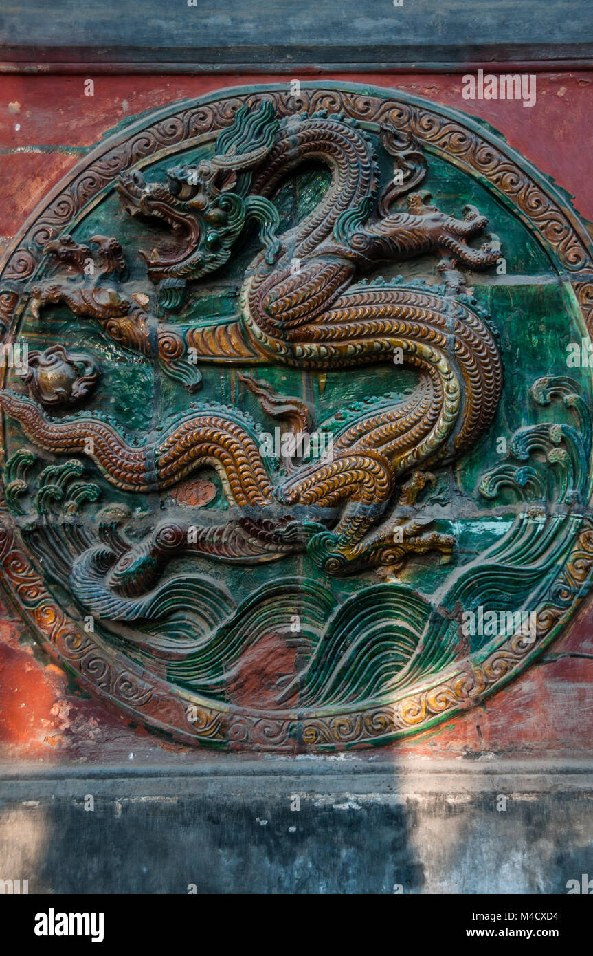 Ming Dynasty era dragon motif on the Ji Gate in the grounds of Hancheng ...