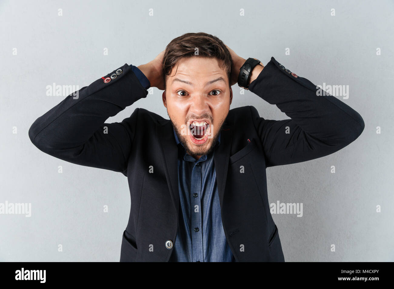 Portrait confused businessman screaming hi-res stock photography and ...