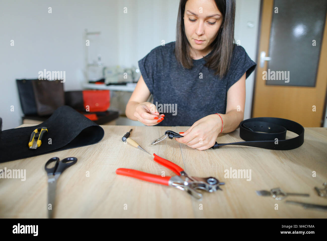 young designer making women bags for sale Stock Photo - Alamy