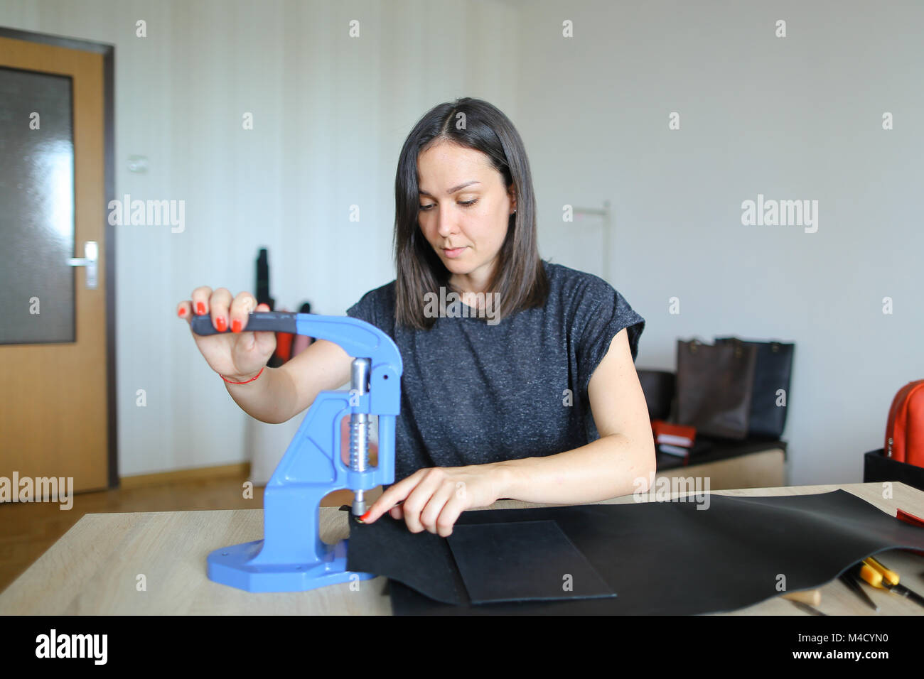young designer making women bags for sale Stock Photo - Alamy