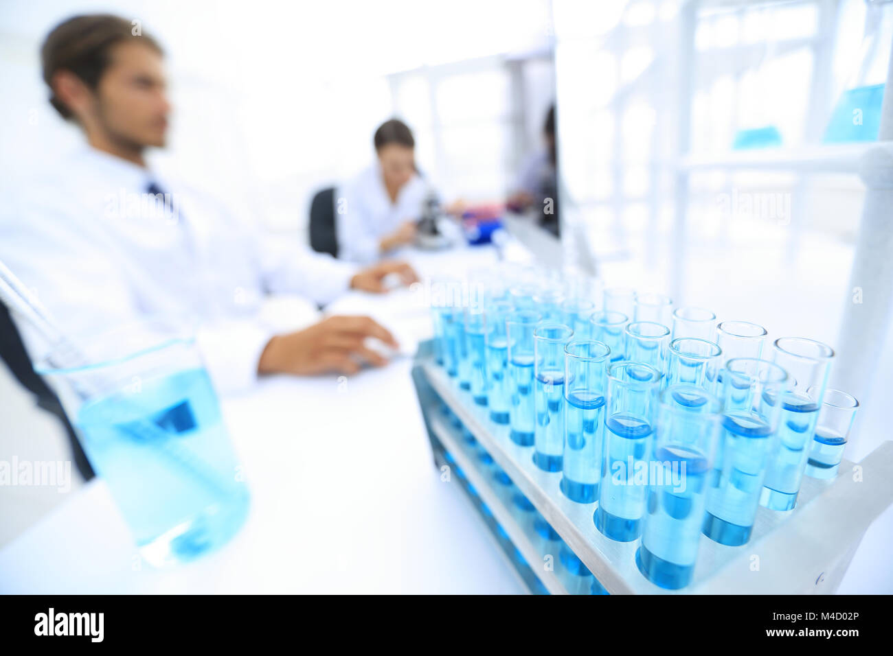 side view of scientists working in laboratory Stock Photo - Alamy