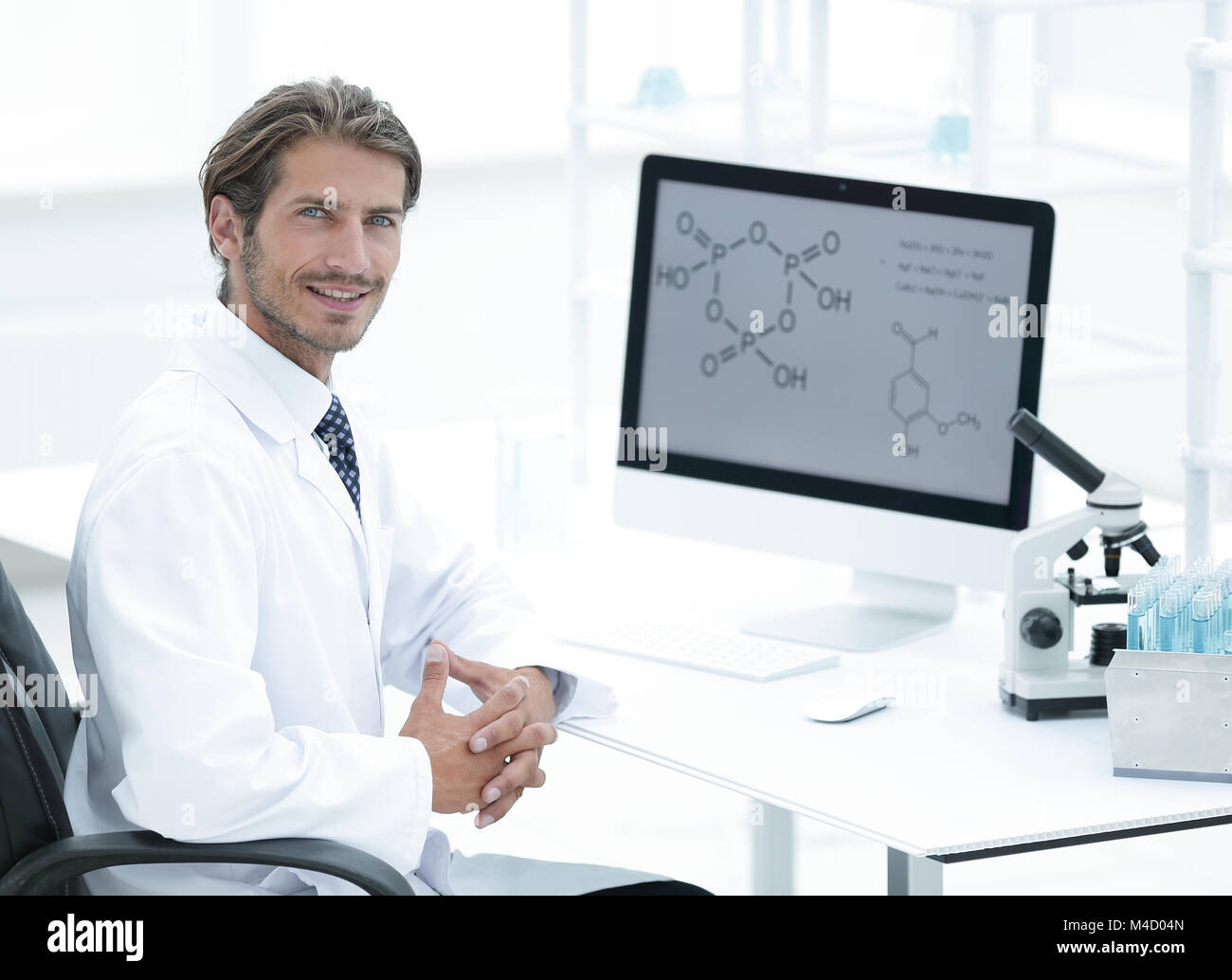 Portrait of a male scientist with a monitor looking at the camer Stock ...