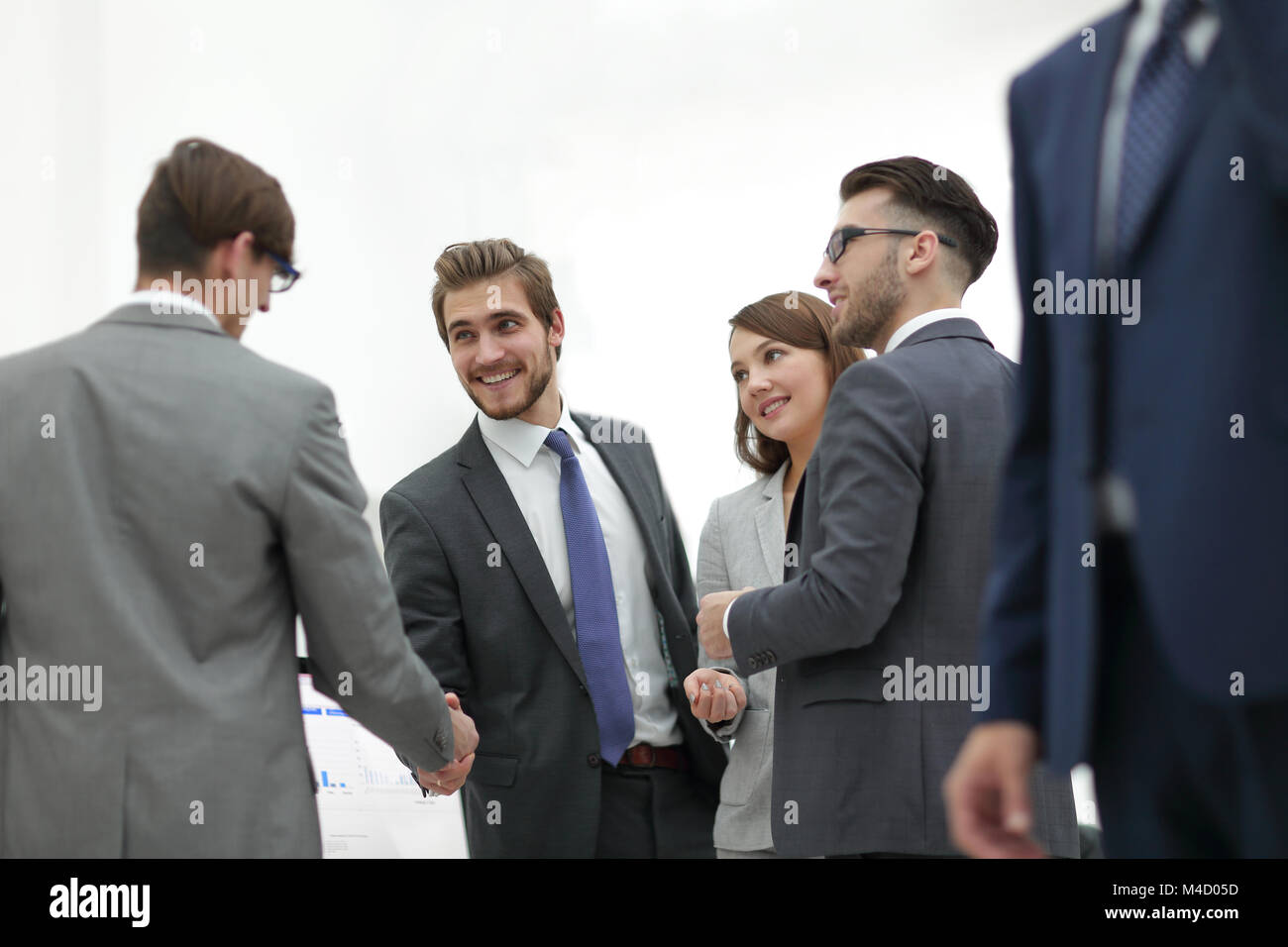 Confident young people, handshake and smile Stock Photo - Alamy
