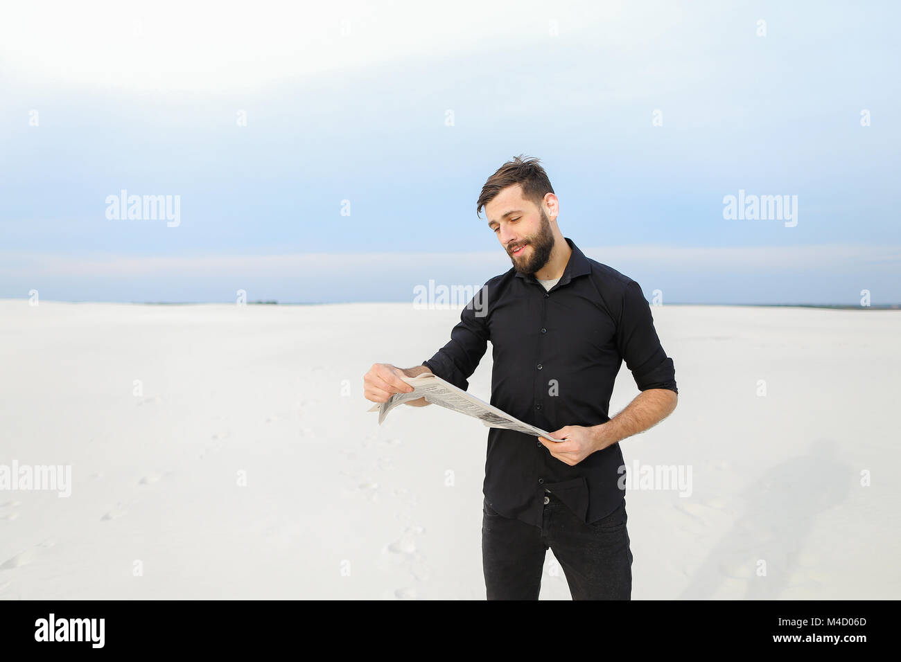 doctor reading newspaper in countryside Stock Photo - Alamy