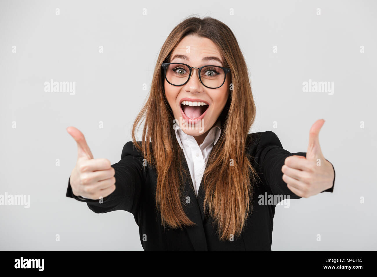 Portrait businesswoman showing thumbs up hi-res stock photography and images - Alamy