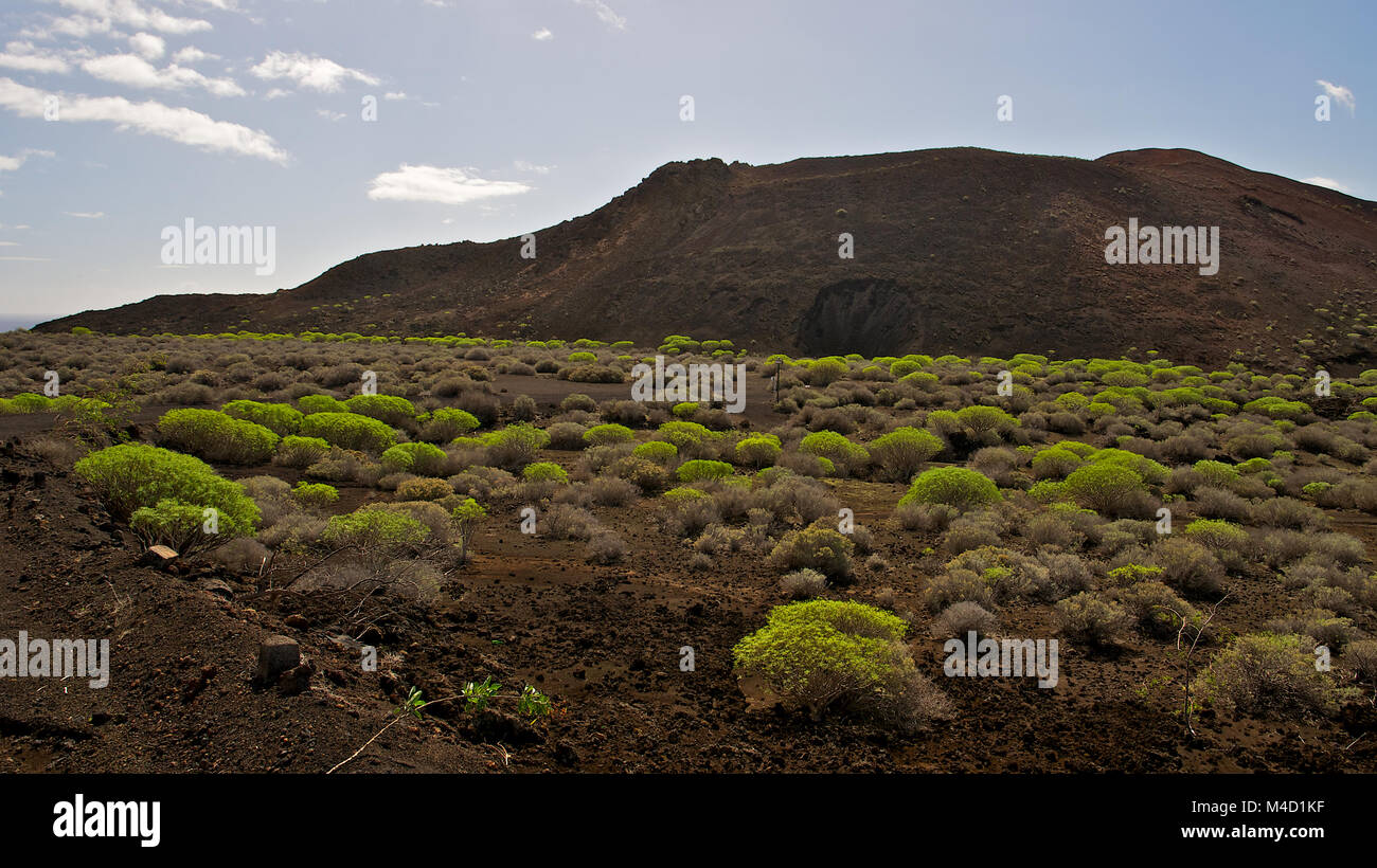 Panoramic view of Orchilla volcanic cinder cone at Punta de la Orchilla ...