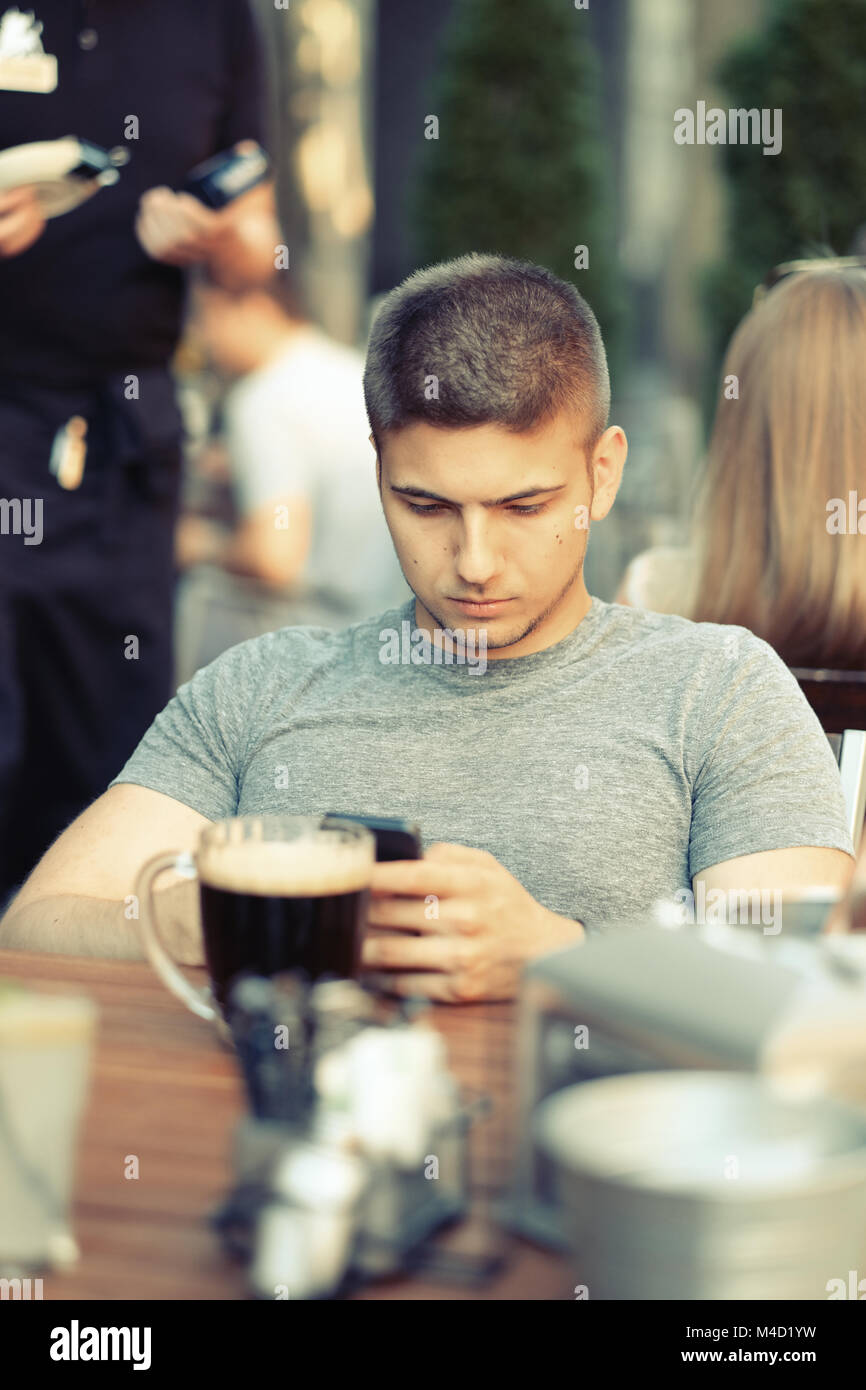 Waiter using mobile phone hi-res stock photography and images - Alamy