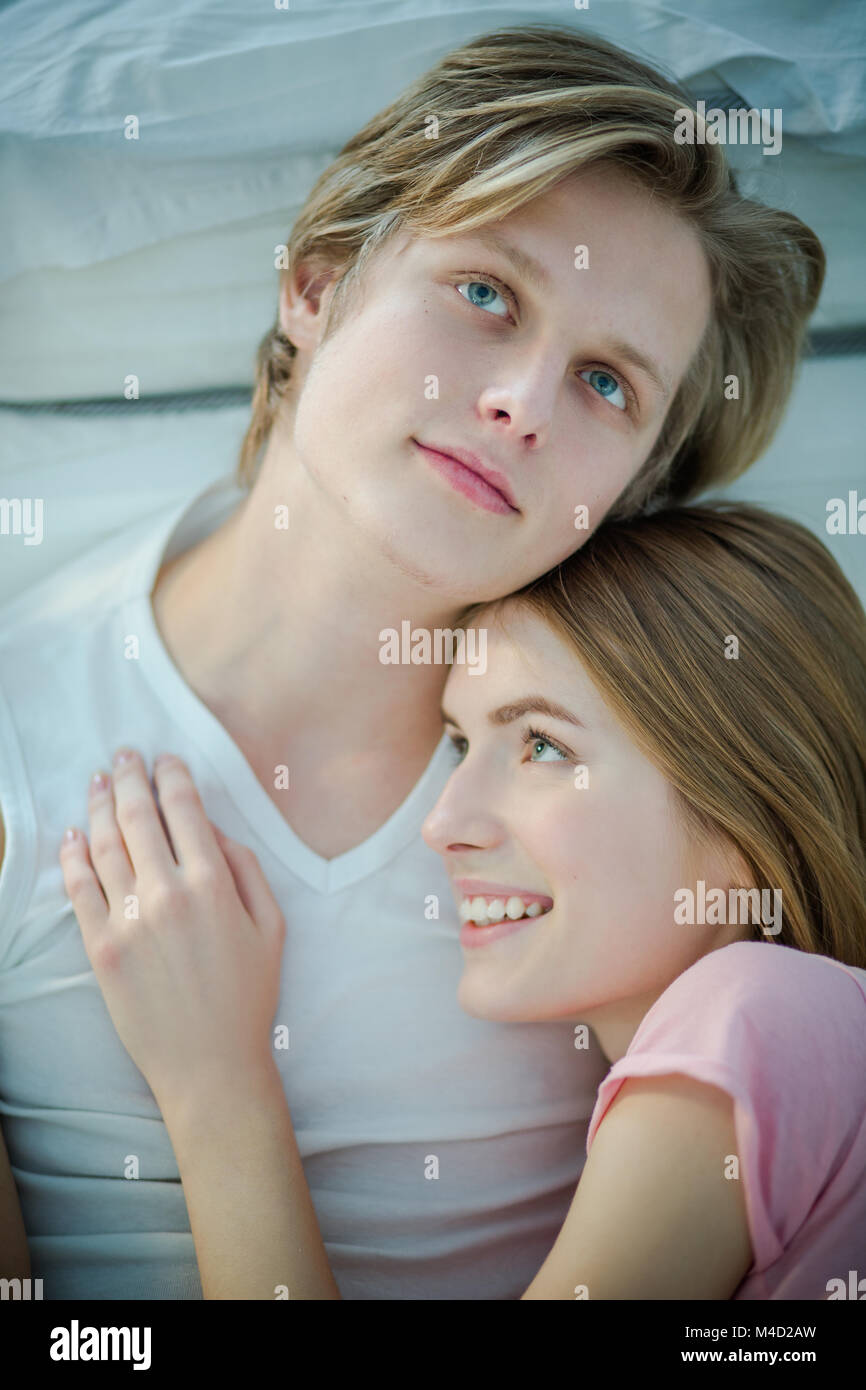 Man and woman snuggling sofa hi-res stock photography and images - Alamy