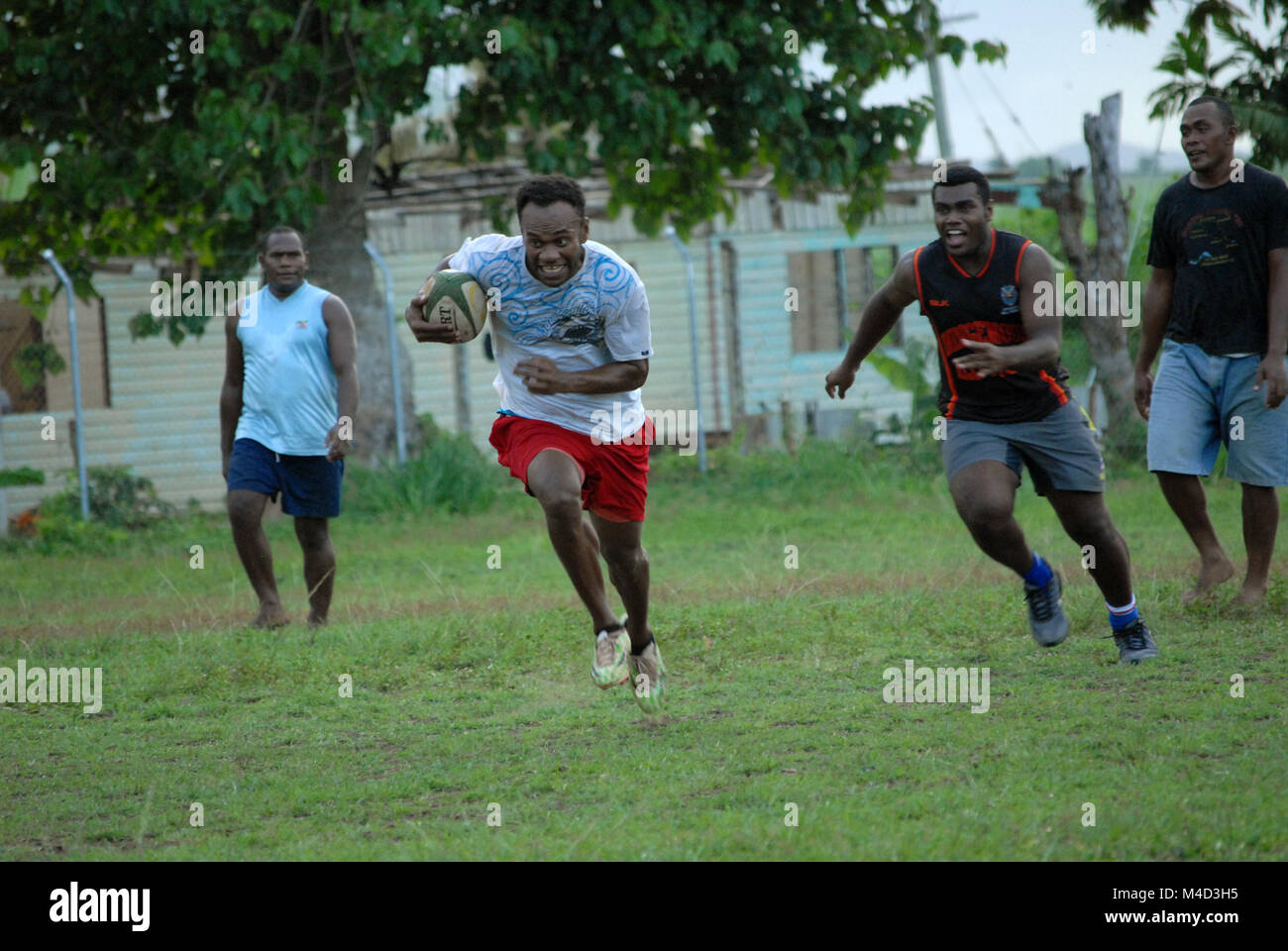 Fijian men playing rugby, Rakiraki playing field, Fiji Stock Photo - Alamy