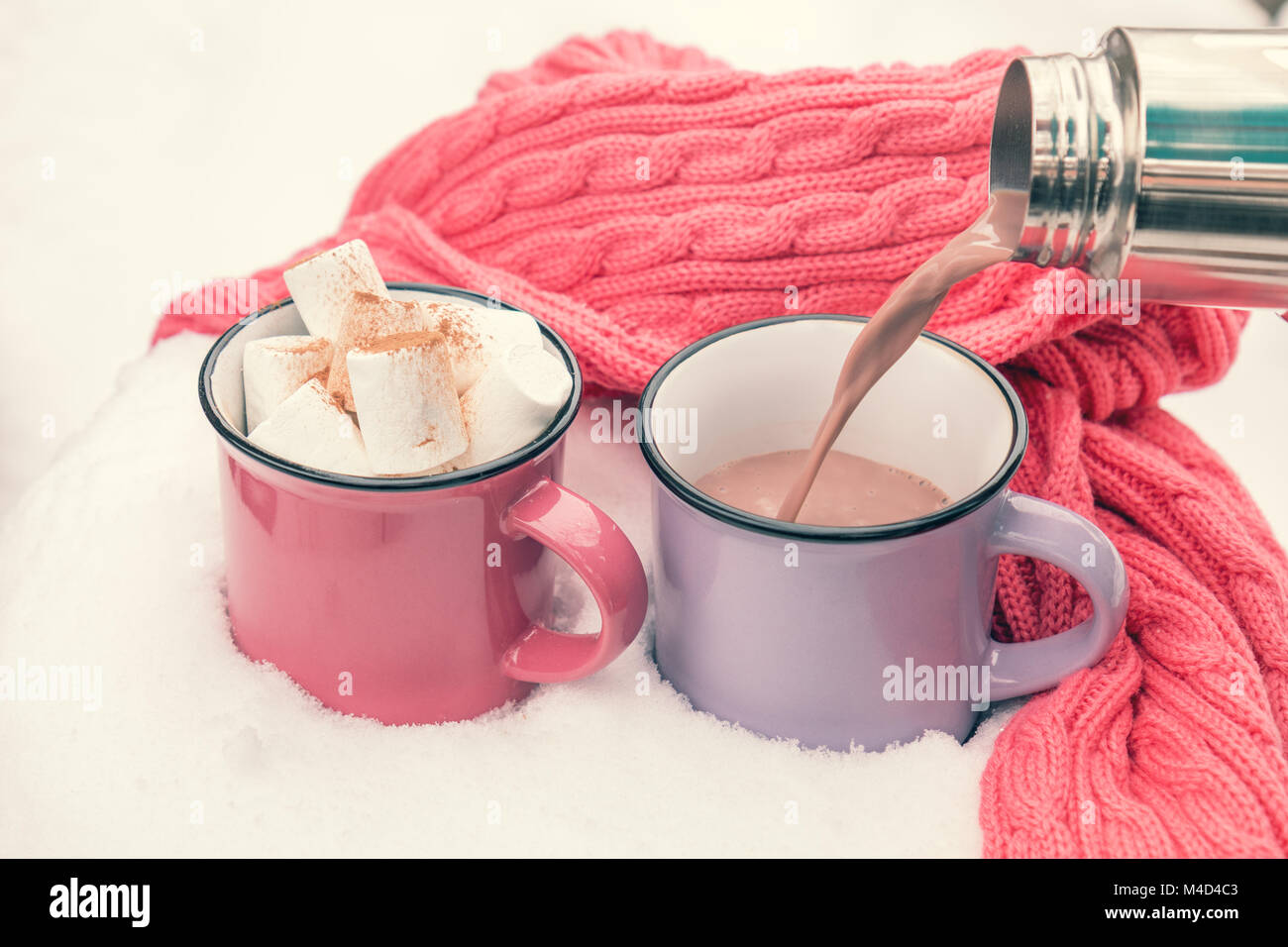Pouring hot chocolate in the cup Stock Photo - Alamy
